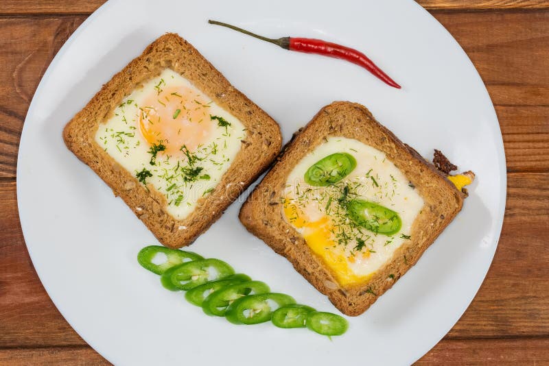 Two Open Sandwiches with Fried Egg on a White Dish Stock Image - Image ...