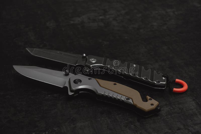Two Opened Tactical Military Knives with Sharp Blade. Tool on Dark ...