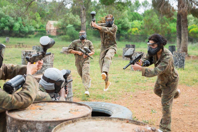 Two Active Opposing Teams with Guns Playing Paintball Stock Image ... Two Active Opposing Teams with Guns Playing Paintball Stock Image ...