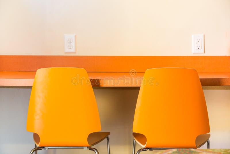 Two Orange Chairs at an Orange Desk Stock Photo - Image of design ...