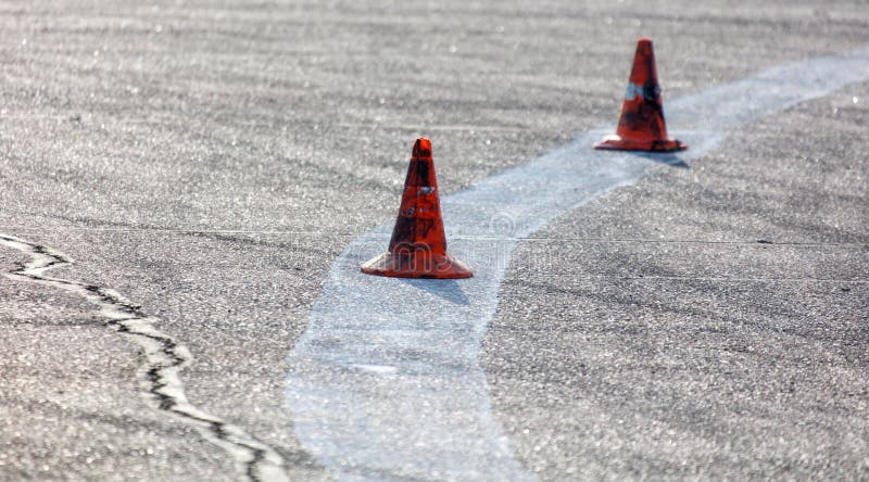 Two Orange Cones are on a Road, with a White Line in between Them Stock ...
