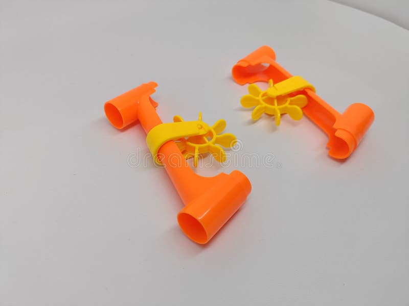 Orange Marble Run Track Components with Yellow Spinning Wheels Stock ...