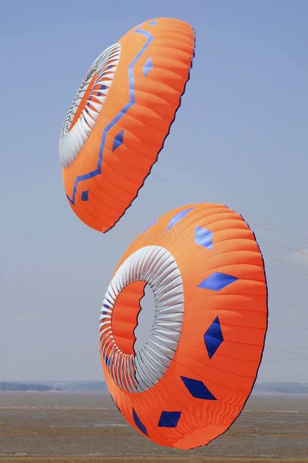 Two orange round kites stock photo. Image of coast, promenade - 32192034