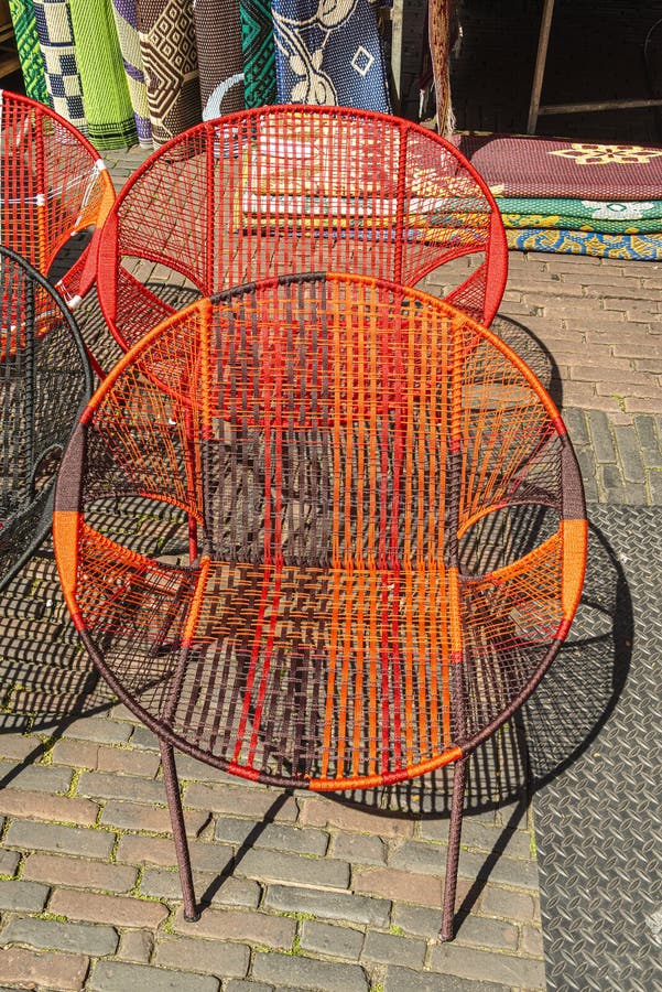 Two Orange Tinted Chairs with Mesh Structure Stock Image - Image of ...