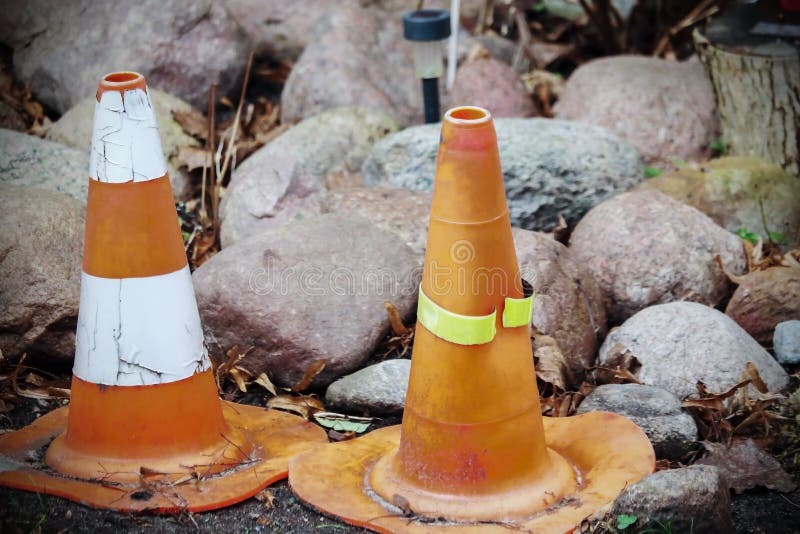 Two Orange Traffic Cones Standing on Big Rocks Stock Photo - Image of ...