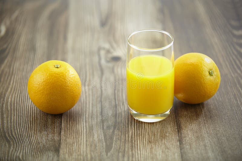 Two Oranges and a Glass of Orance Juice Stock Photo - Image of extract ...