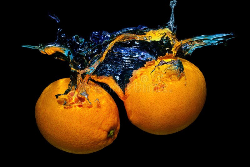 Two Oranges in Water Splashes Isolated on Black Stock Image - Image of ...