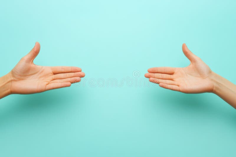 Two Outstretched Hands Reaching Towards Each Other Against a Light Blue ...