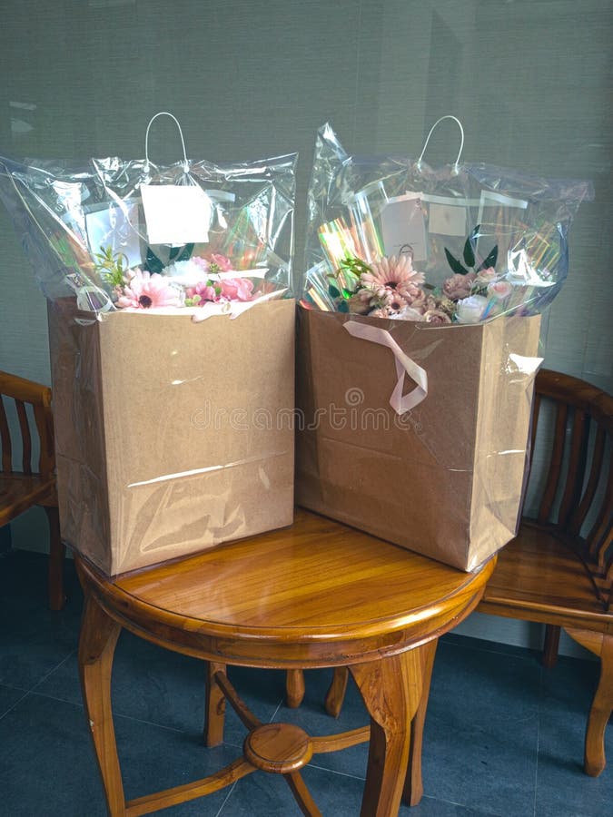 Two Packages of Artificial Flower Bouquets on the Table. Stock Photo ...