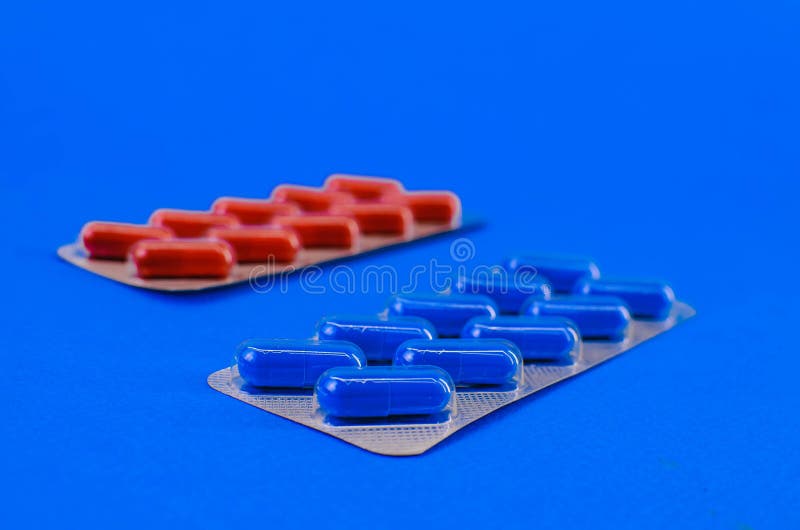 Red and Blue Tablets in the Hand of a Sick Man Stock Image - Image of ...