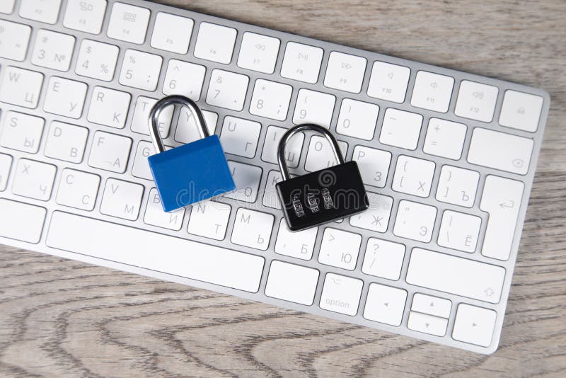 Two padlock on a keyboard stock photo. Image of privacy - 268615348