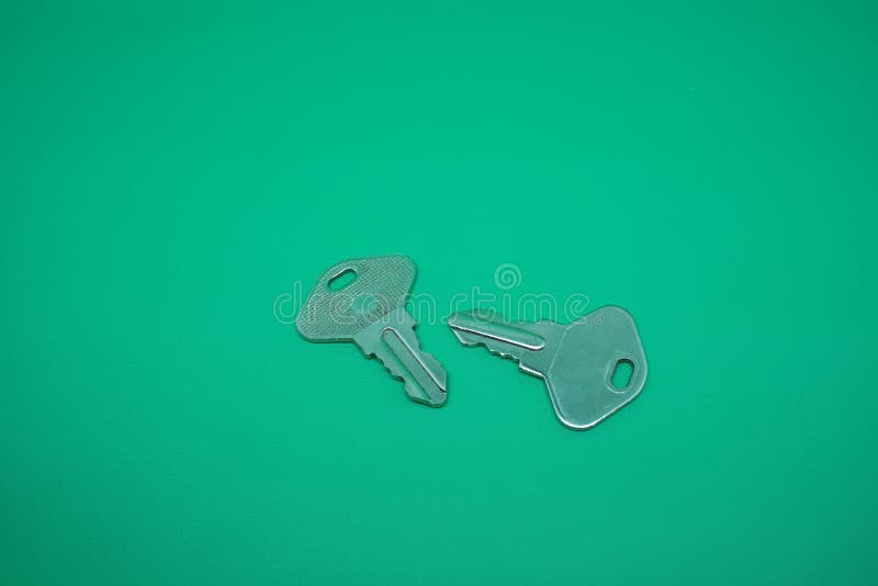 Two Pair Stainless Key Isolated on Green Stock Photo - Image of ...