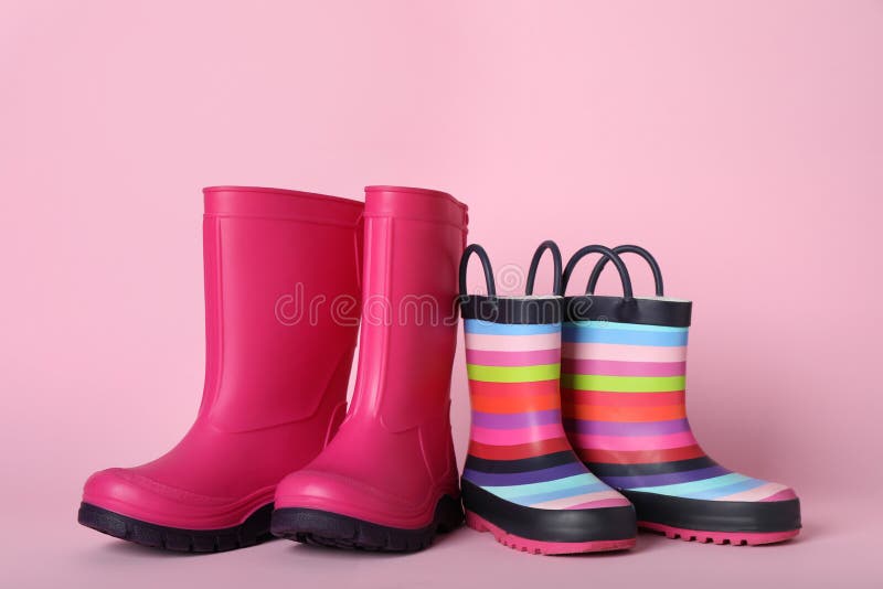 Two Pairs of Rubber Boots on Pink Background Stock Image - Image of ...