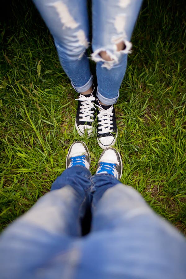 Two Pairs of Shoes on a Green Meadow Stock Photo - Image of carefree ...