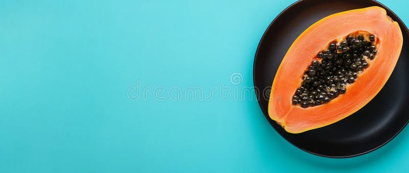 Two Papaya Halves Resting on a Plate, with a Blue Textured Background ...
