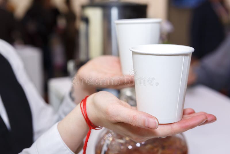 Two paper cups in hand stock image. Image of cardboard - 165164075