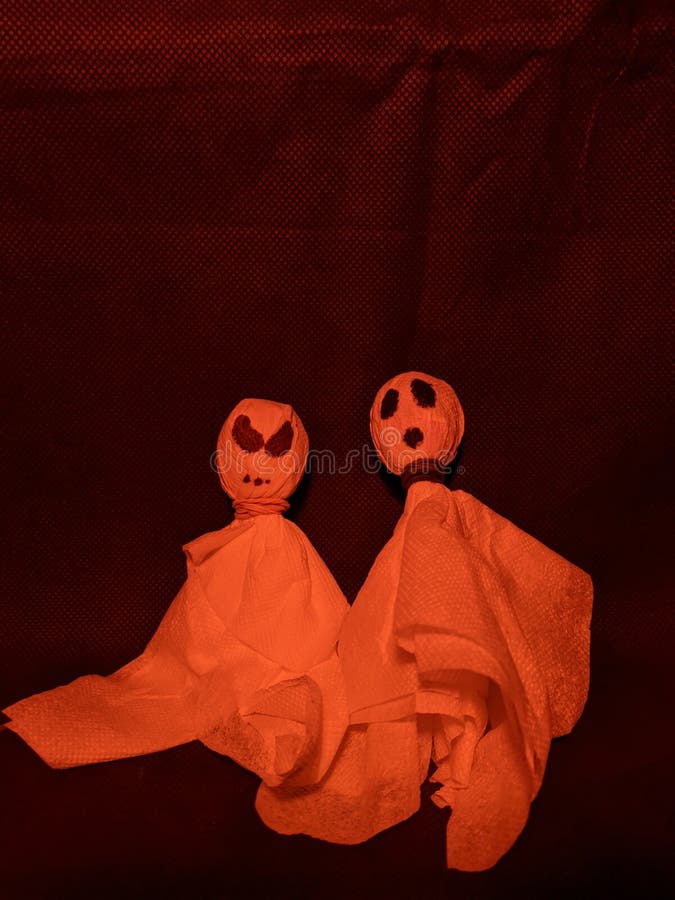 Paper Ghosts on Orange Surface Stock Photo - Image of symbol, concept ...