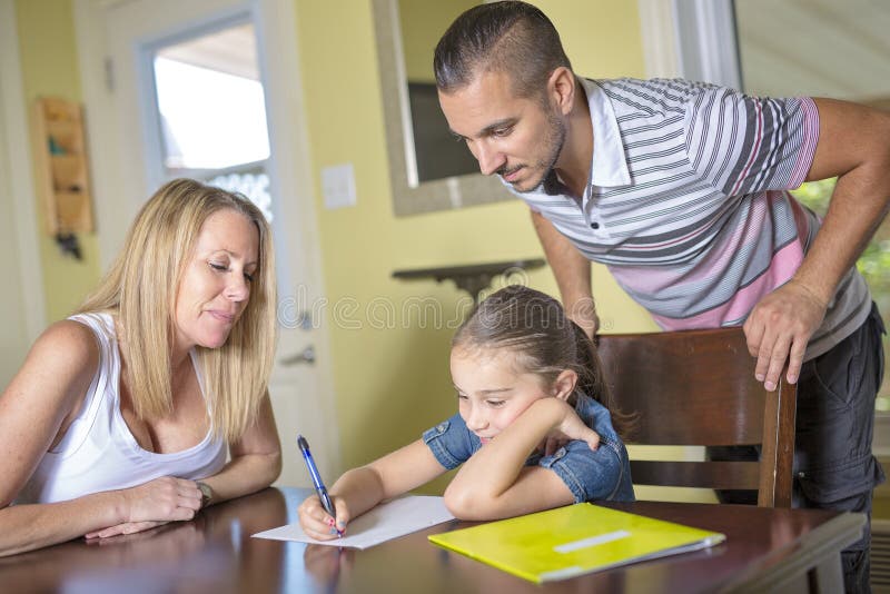 Parents Helping Son with Homework in Home Interior Stock Photo - Image ...