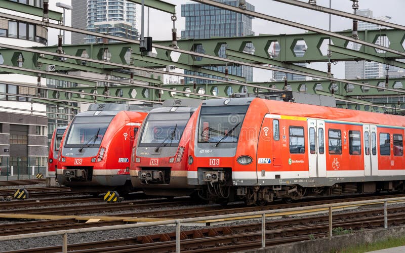 Two Passenger Trains on One of the Tracks at an Elevated Station ...