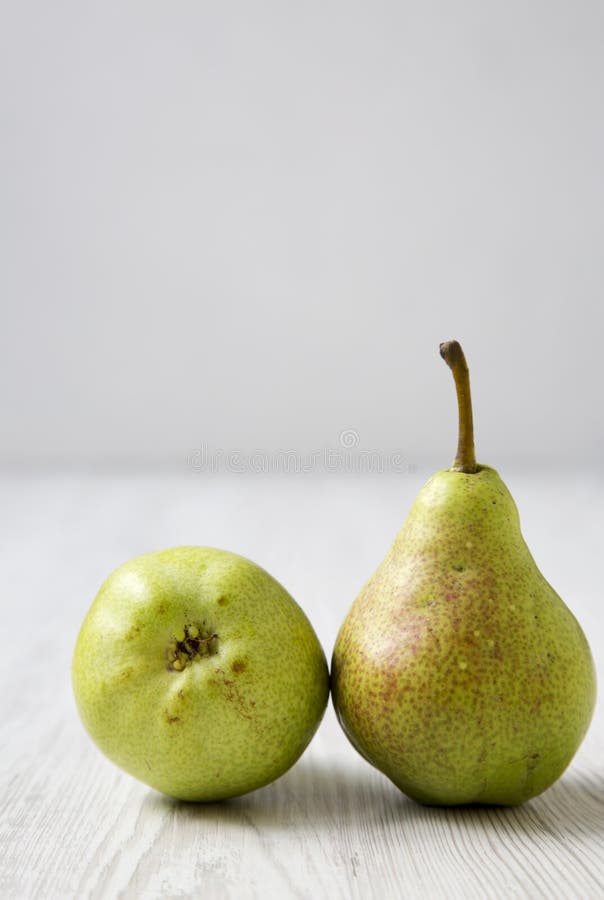 Two Pears on a White Wooden Table, Side View. Stock Image - Image of ...