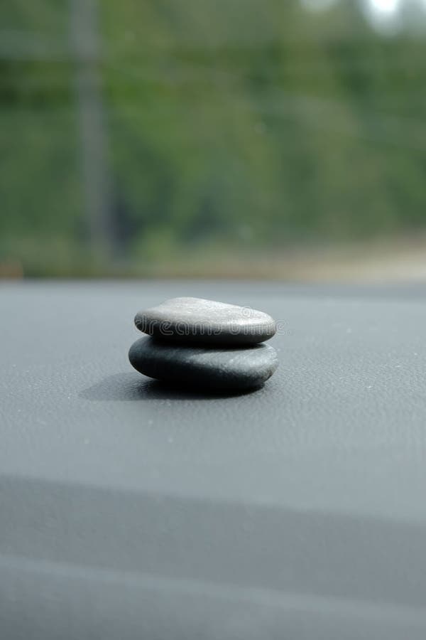 Two Pebbles Balanced on Top of Each Other Stock Image - Image of ...