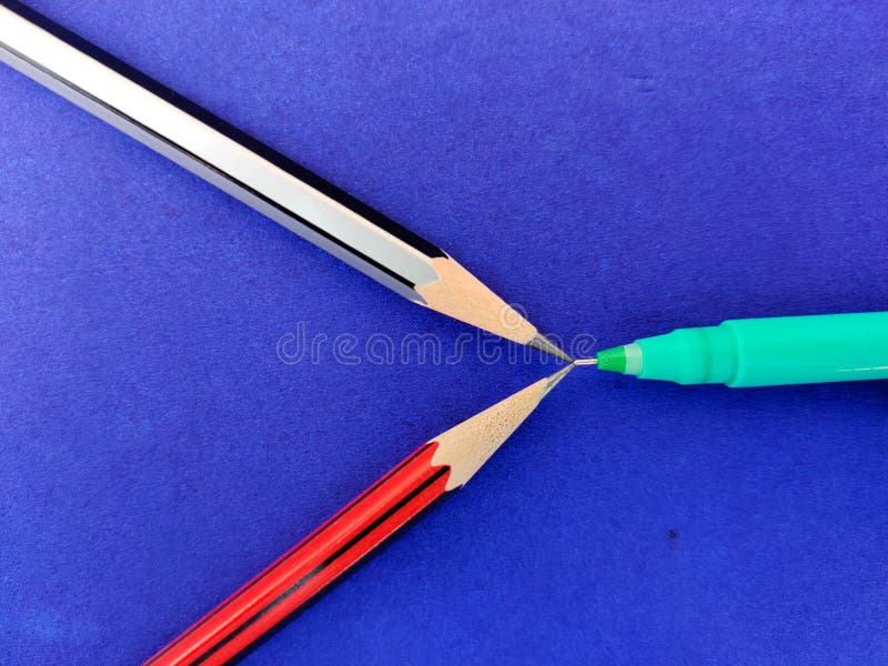Two Pencil and Pen Pointing Each Other Stock Photo - Image of draw ...