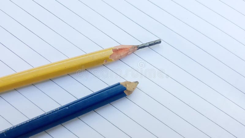 Two Pencils Yellow and Blue on Top of Paper Work Stock Photo - Image of ...