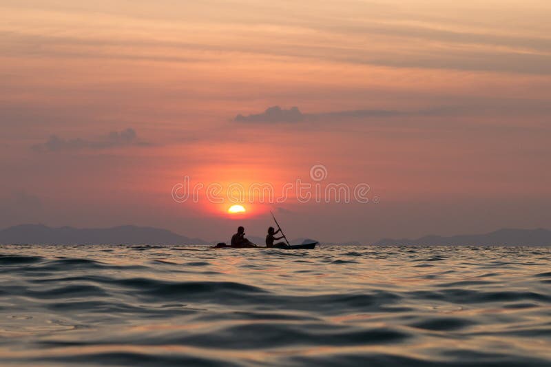 Two People in the Boat Against a Sunset Stock Photo - Image of warm ...