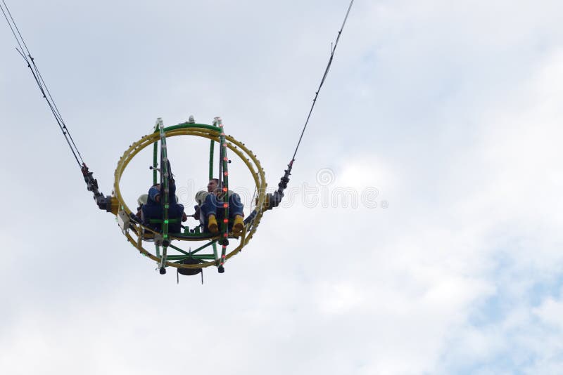 Two People on the Bungee Ride Bottom View Stock Image - Image of jump ...