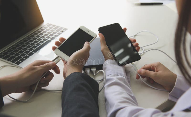 Two People Connecting the Mobile To a Power Bank.Technology Device ...