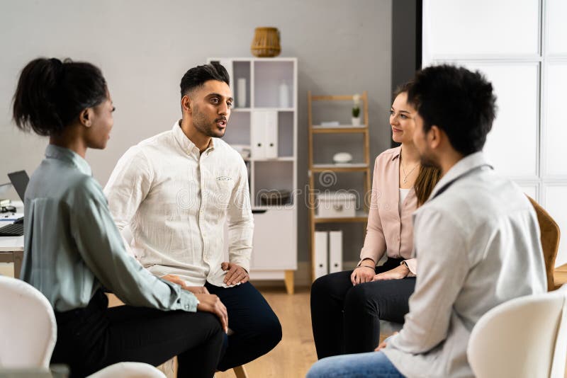 Two People Consoling Young Man during Group Therapy Stock Image - Image ...