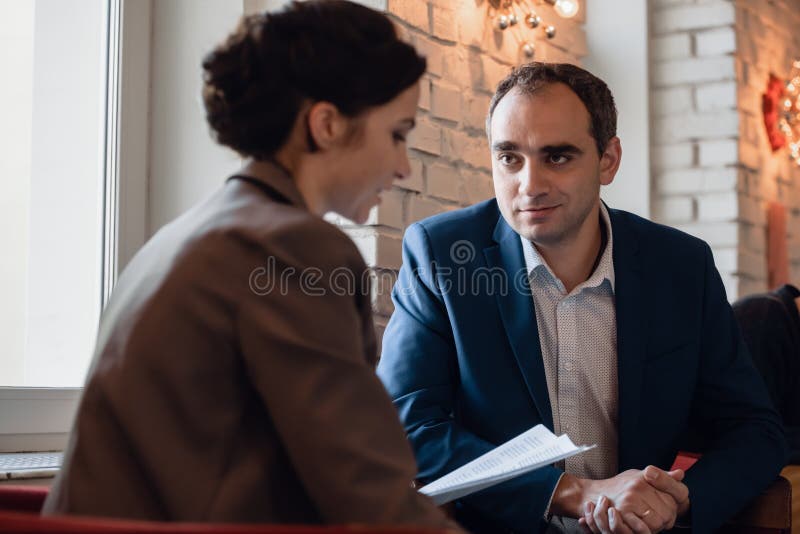 Two People Discussing Bussiness Questions in an Informal Setting Stock ...