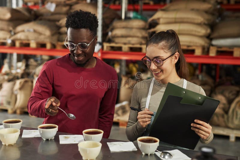 Two People Discussing Coffee during Cupping in Coffee Factory Workshop ...