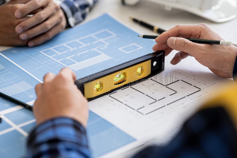 Two People are Discussing the Design of the Building Plan, the ...