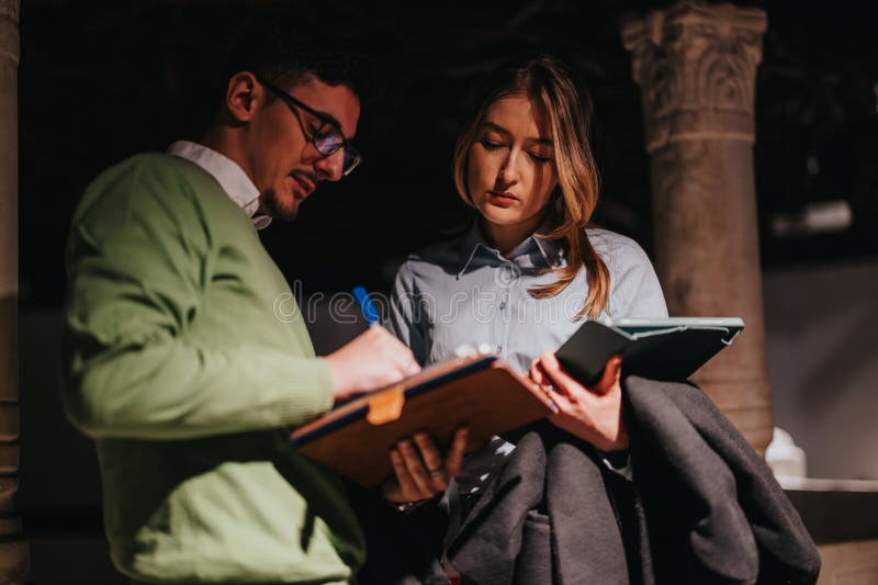 Two People Discussing Notes during a Visit To a Historical Museum Stock ...