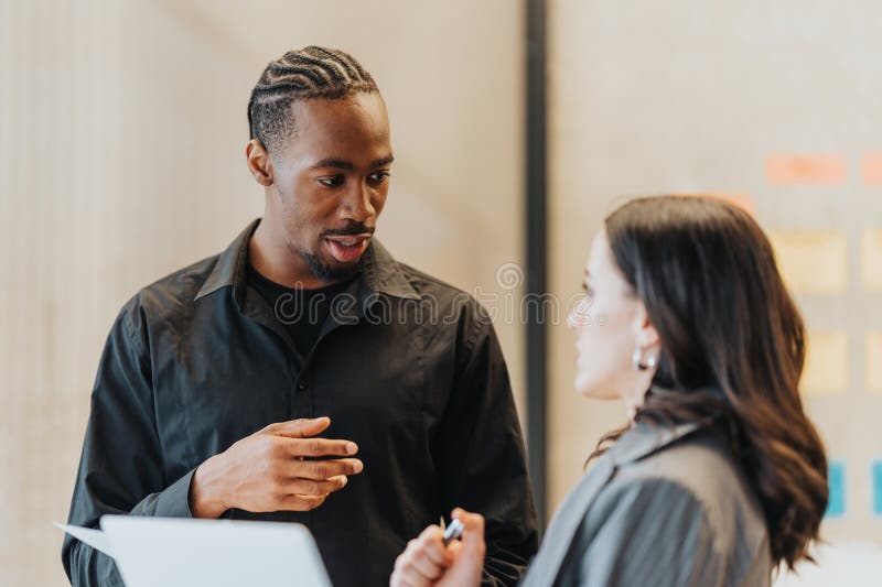 Diverse Business People Engaging in a Collaborative Discussion during a ...
