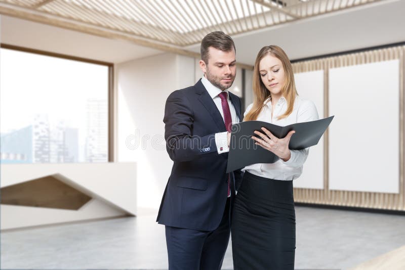 Two People Discussing Work Issues in Office Lobby Stock Image - Image ...