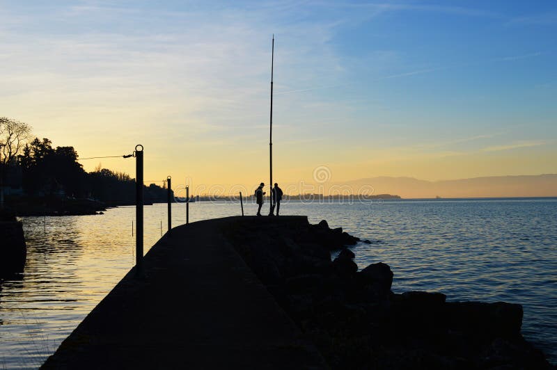 Two People on the Dock of the Lake Stock Photo - Image of silhouette ...