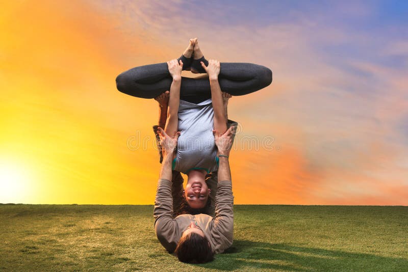 The Two People Doing Yoga Exercises Stock Photo - Image of peaceful ...