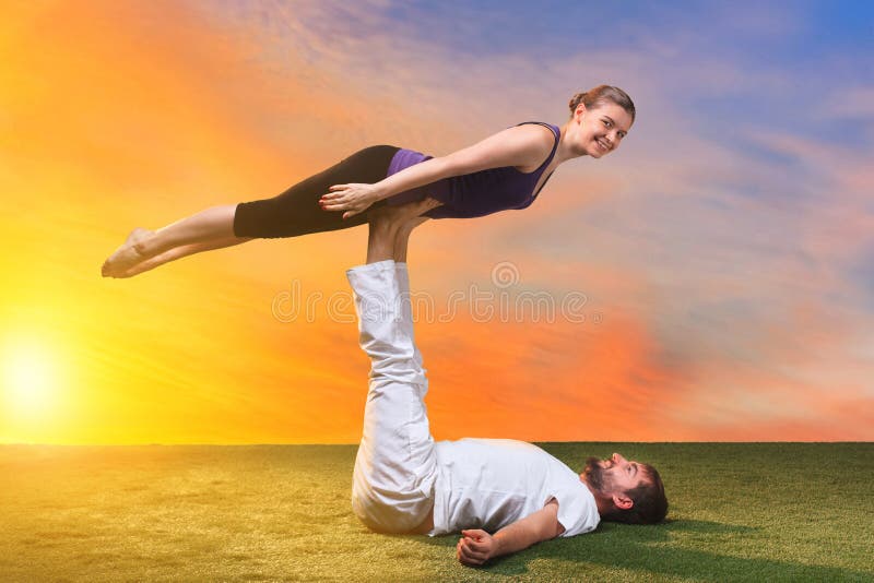 The Silhouette of Two People Doing Yoga Exercises Stock Image - Image ...