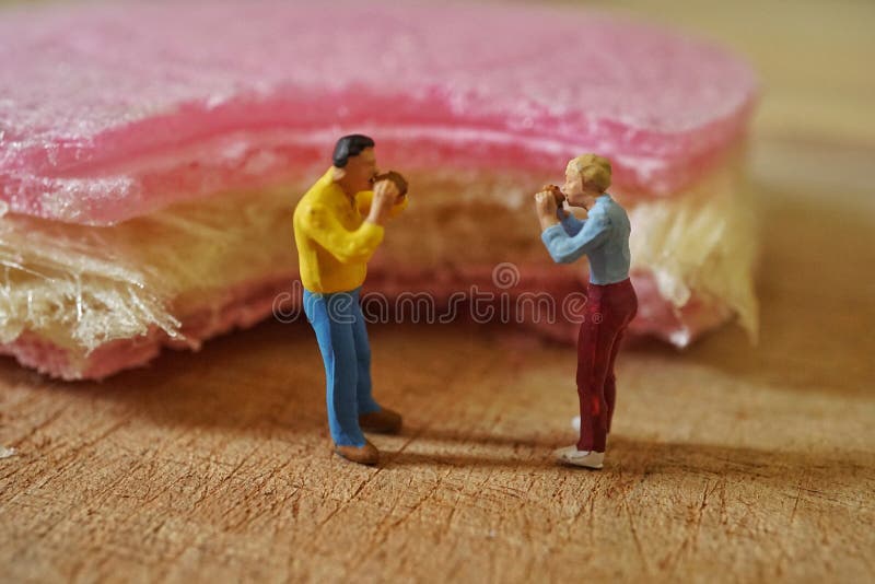 Two People Enjoying Sugar Buns Stock Image - Image of face, sugar ...