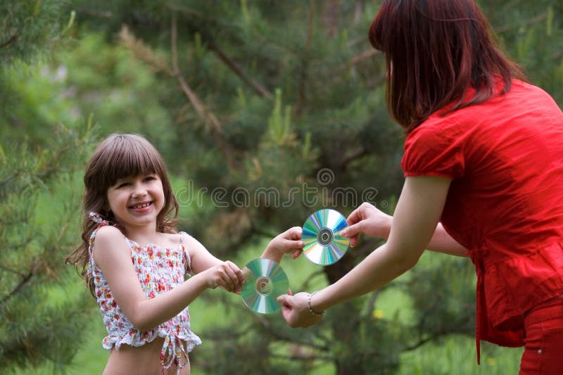 Two People Exchange Compact Disks Stock Photo - Image of young, data ...