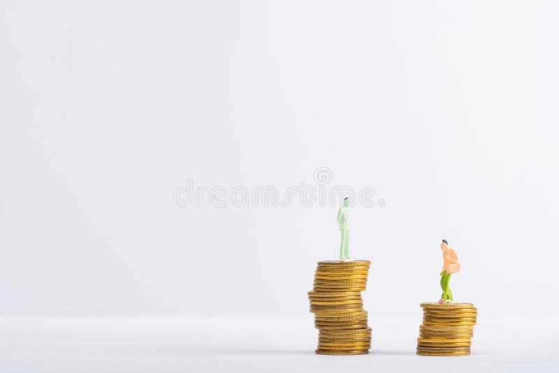 Two People Figures on Stacked Coins on White Surface Isolated on Grey ...
