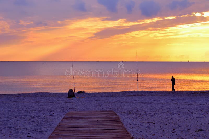 Two People Fishing by the Sea Stock Image - Image of fishing ...