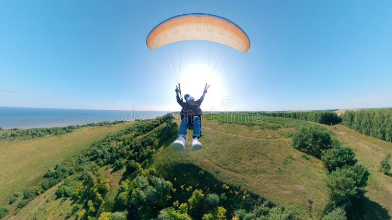 Two People are Flying on the Parawing in a Front View Stock Footage ...