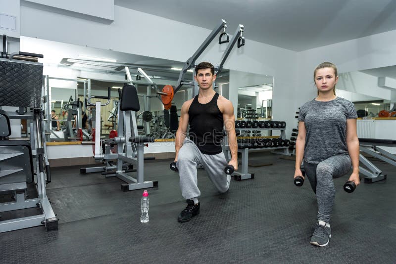 Two People in Gym Making Exercise Together Stock Photo - Image of ...