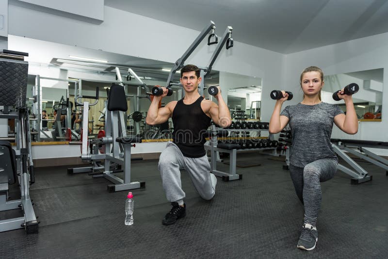 Two People in Gym Making Exercise Together Stock Photo - Image of ...