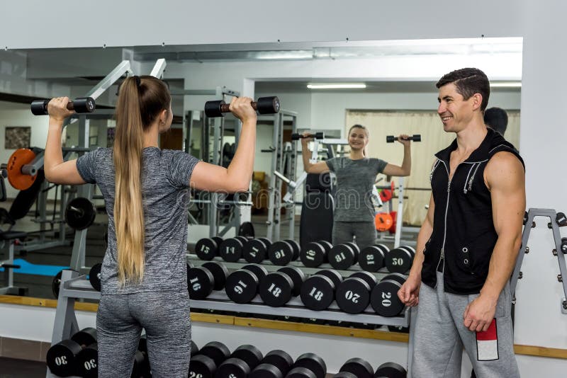 Two People in Gym Making Exercise Together Stock Photo - Image of ...