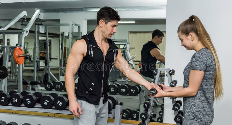Two People in Gym Making Exercise Together Stock Photo - Image of ...