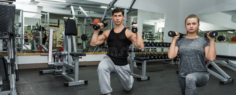 Two People in Gym Making Exercise Together Stock Image - Image of ...
